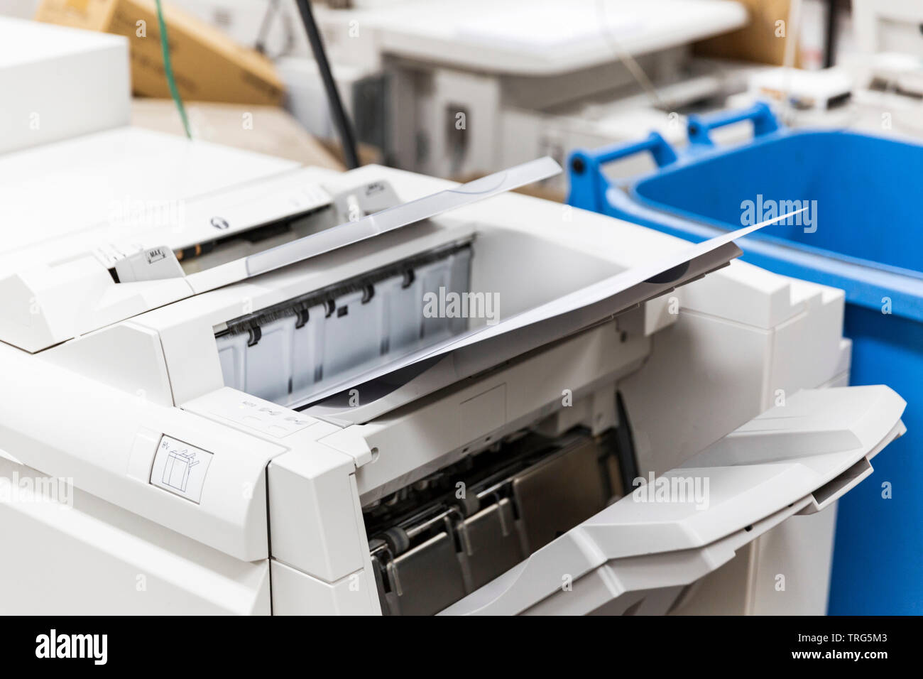 Industrial printing churning out fresh prints on A4 paper Stock Photo ...