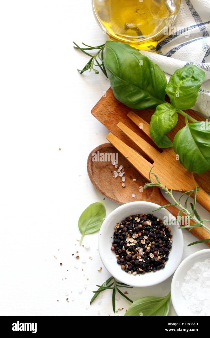 Wooden spoon and knife with ingredients on white background. Top view ...