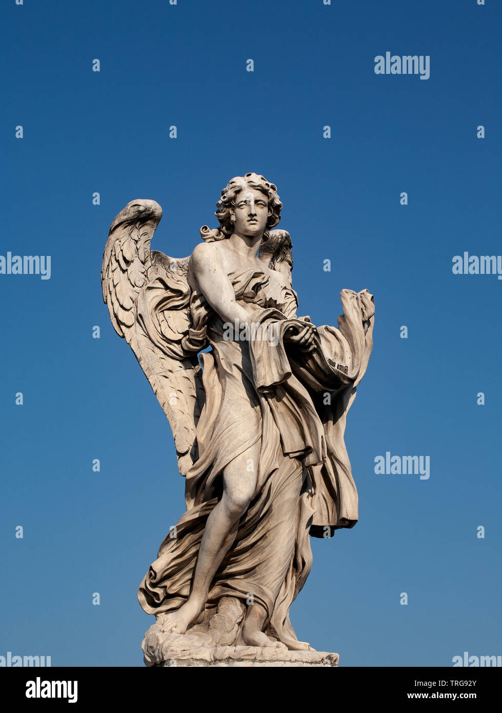 The angel with the garment and dice against a blue, summer sky - one of ...