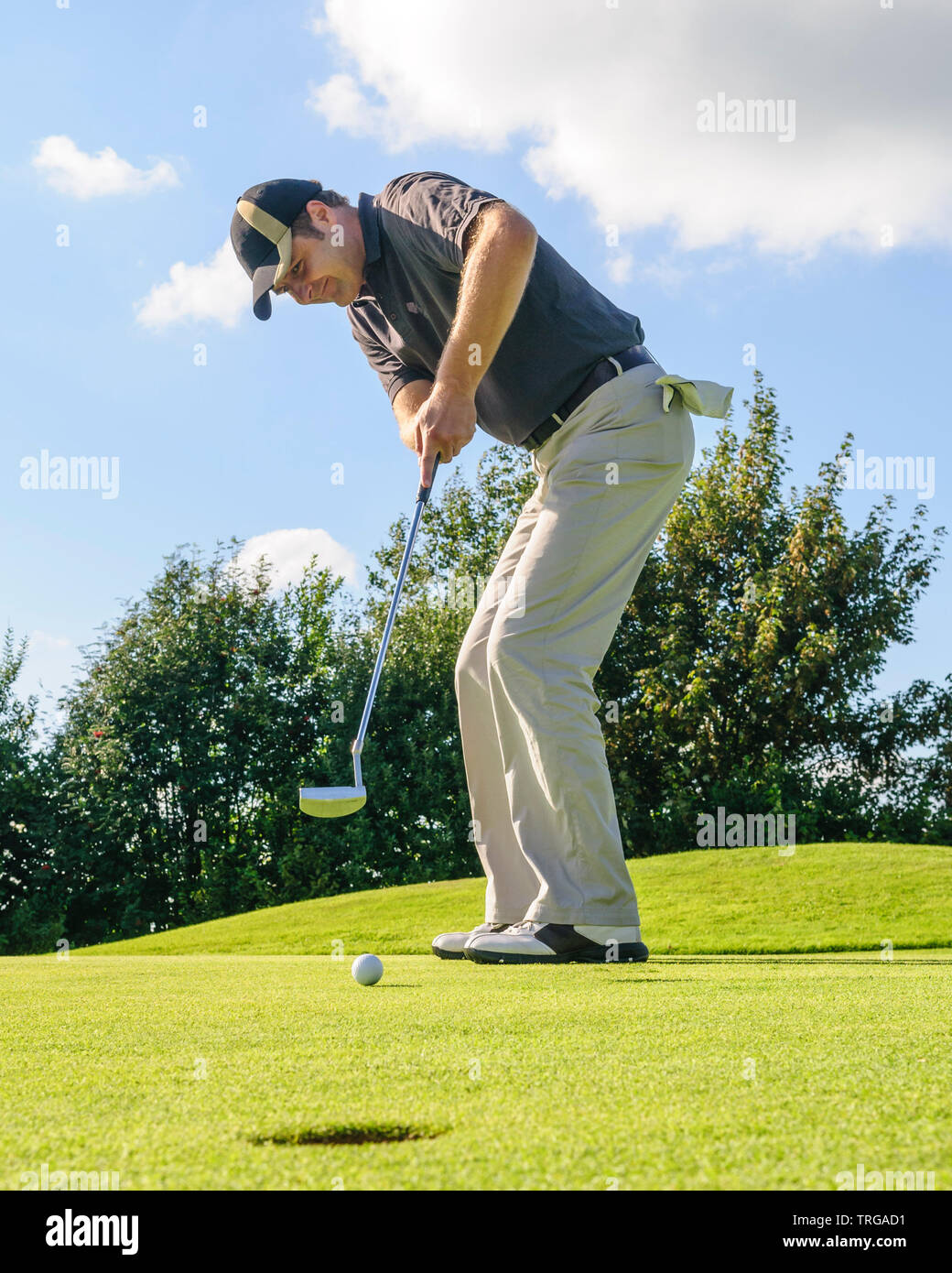 Summer afternoon man playing golf hi-res stock photography and images ...