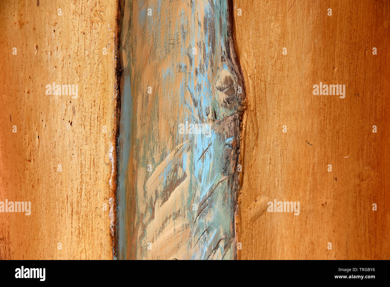 A wooden painted post in a cob wall Stock Photo - Alamy