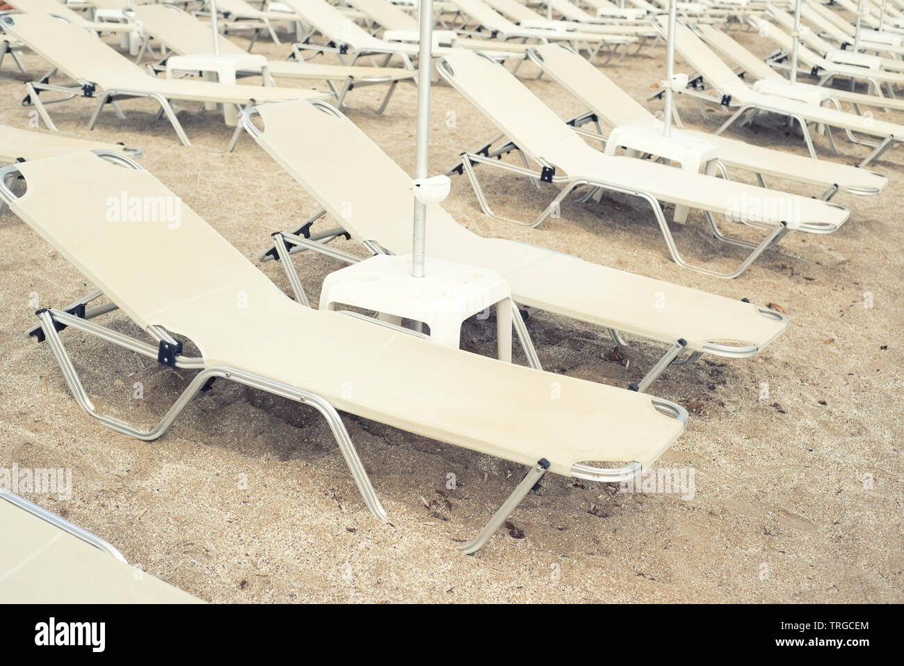 Sun beds on the sand in a row, vintage photography Stock Photo - Alamy