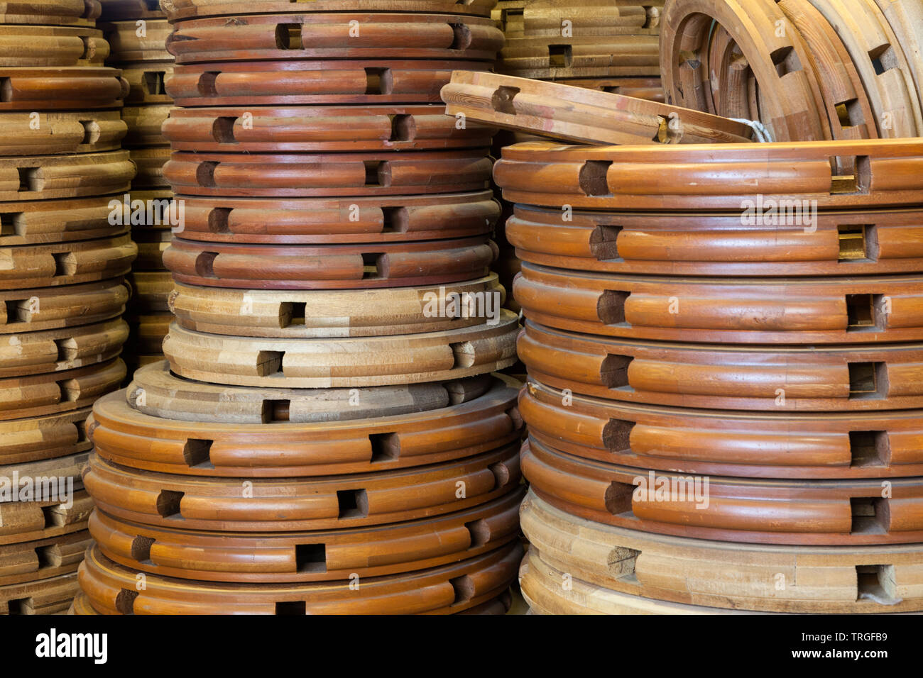 Piles of wooden ship wheels at a former manufacturing site in the ...