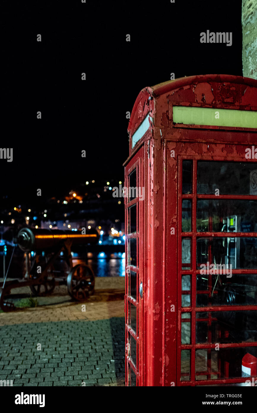 Red telephone box at night, Dartmouth Quayside Stock Photo - Alamy