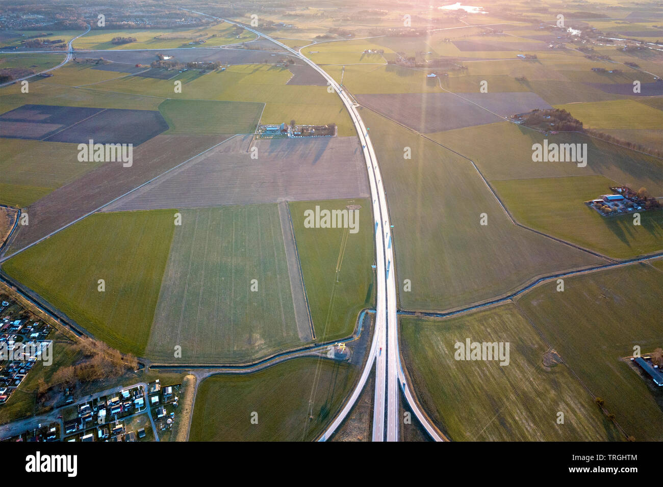 Aerial top view of rural landscape, modern highway road and small farm ...
