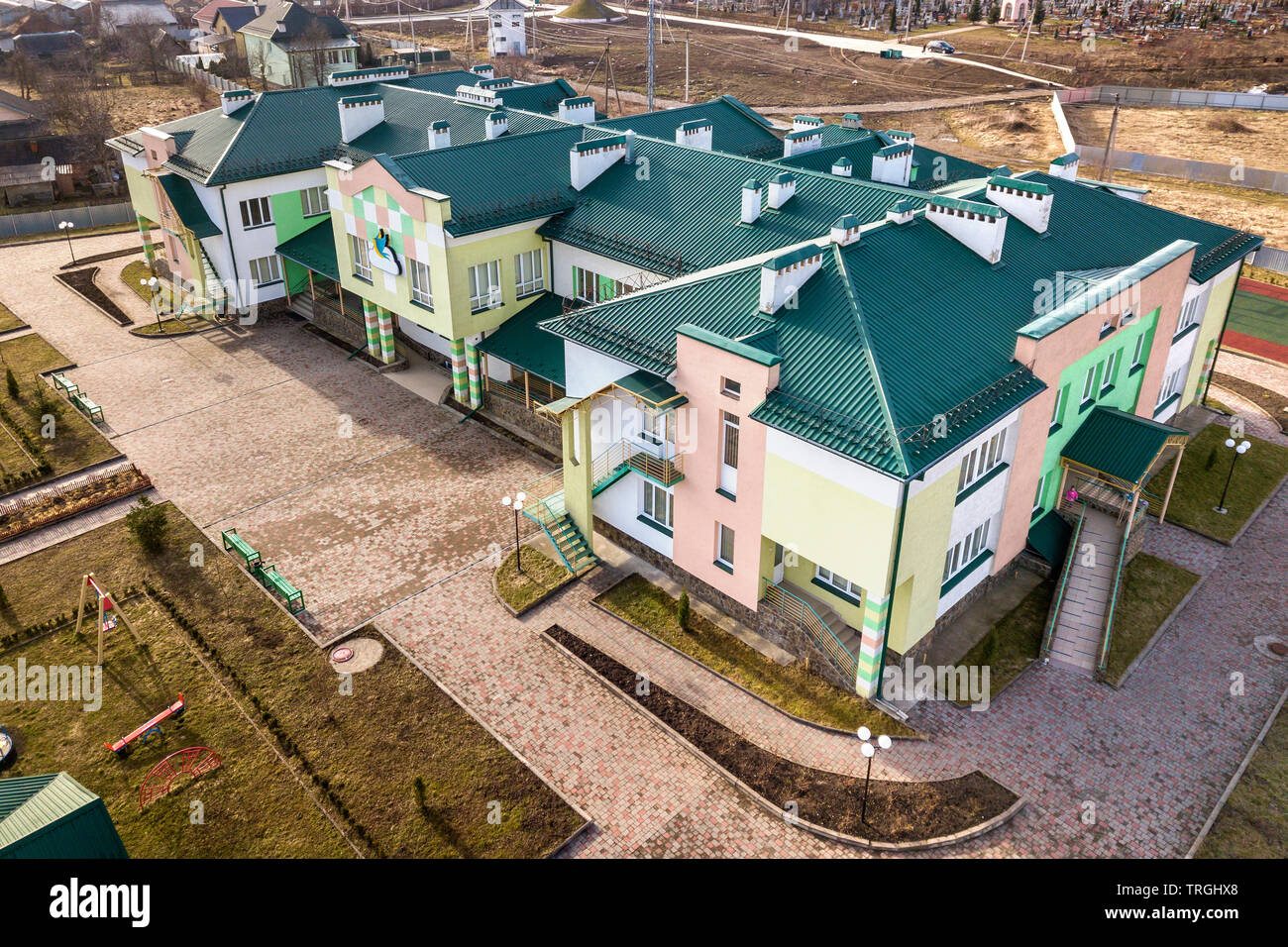 Aerial view of kindergarten or modern school complex, decorated ...