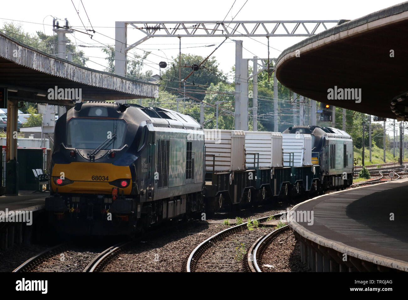 Nuclear flask freight train leaving Carnforth station top and tailed by ...