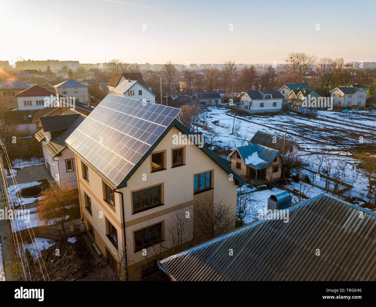 Aerial view of new modern two story house cottage with blue shiny solar ...