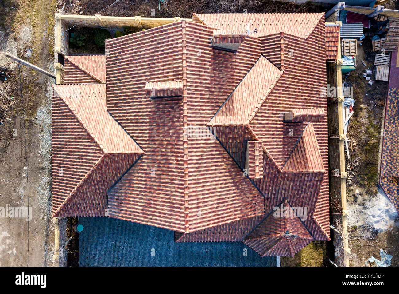 Top aerial view of building complex shingle roof construction. Abstract ...