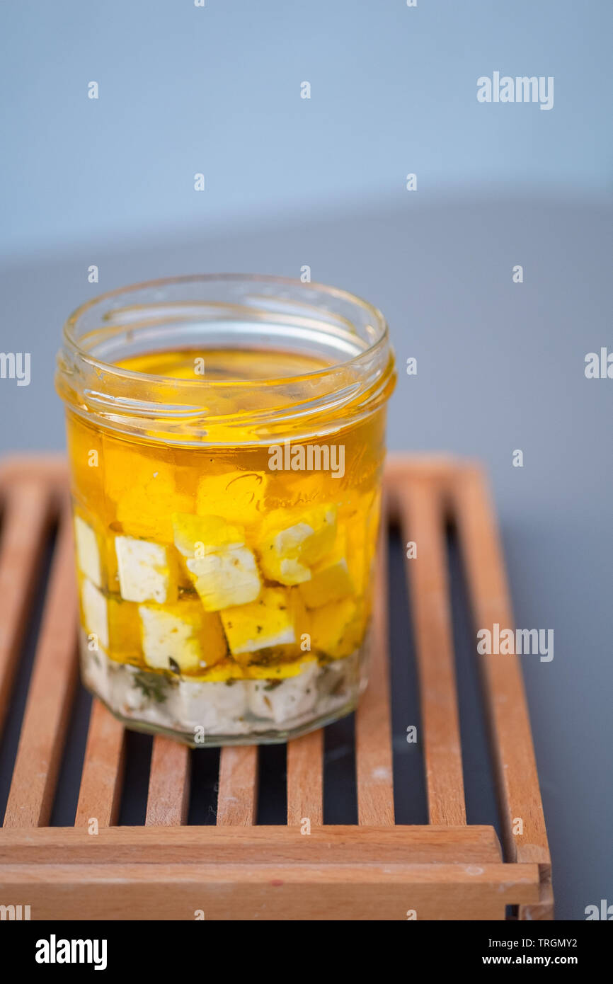Marinated Feta in olive Oil Stock Photo - Alamy