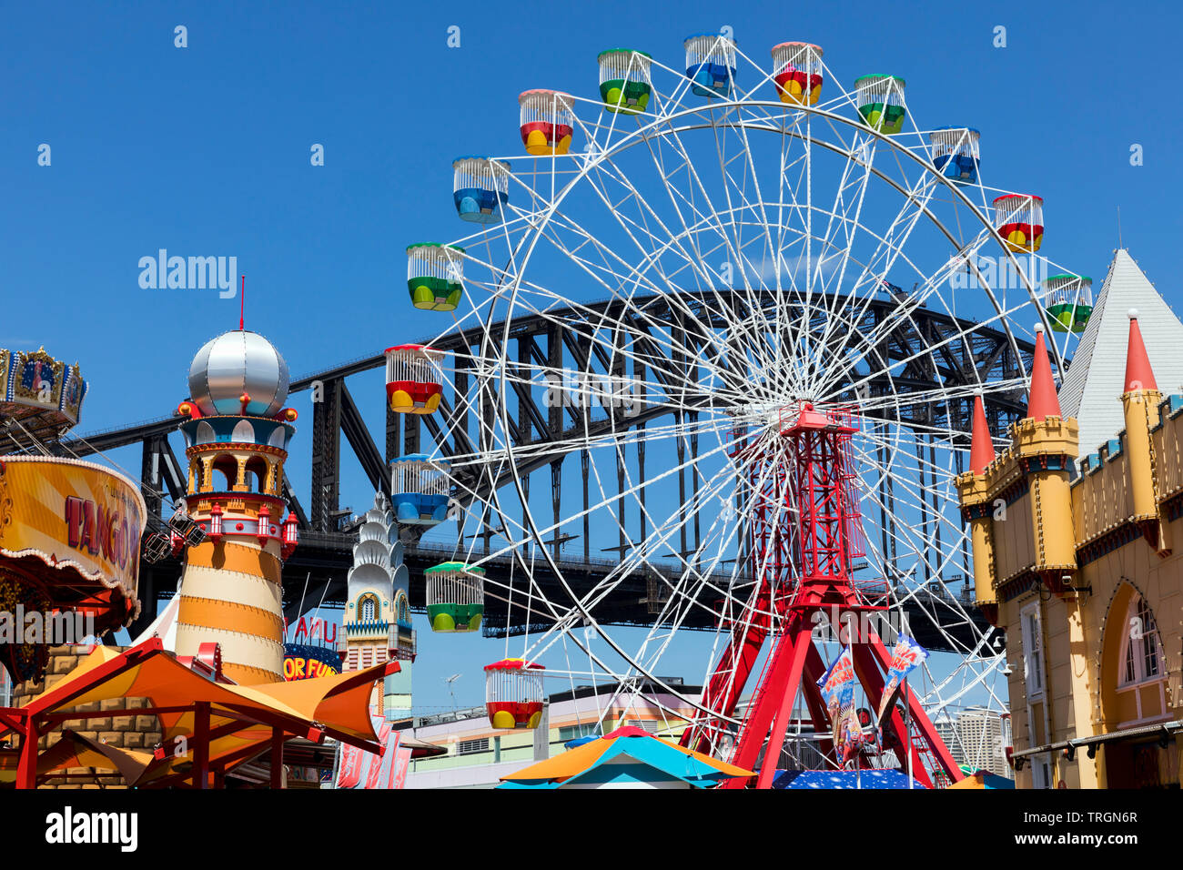 Australia, NSW, Sydney, Luna Park, colourful ferris wheel at Luna Park ...