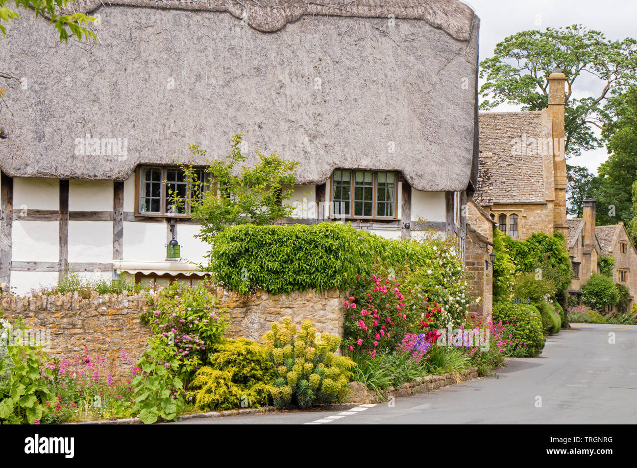 Thatched cottages in the Cotswold village of Stanton, Worcestershire ...