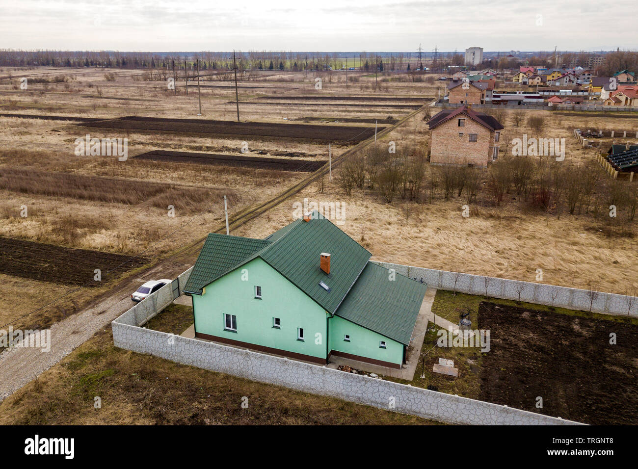 Aerial top view of new residential house cottage with brick chimney and ...