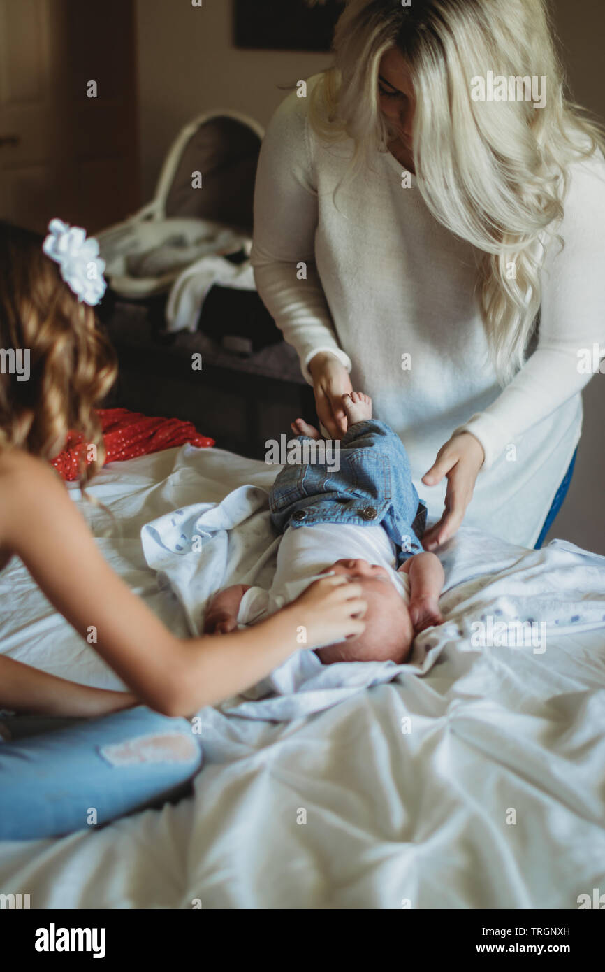 family at home with a new baby in the nursery Stock Photo - Alamy