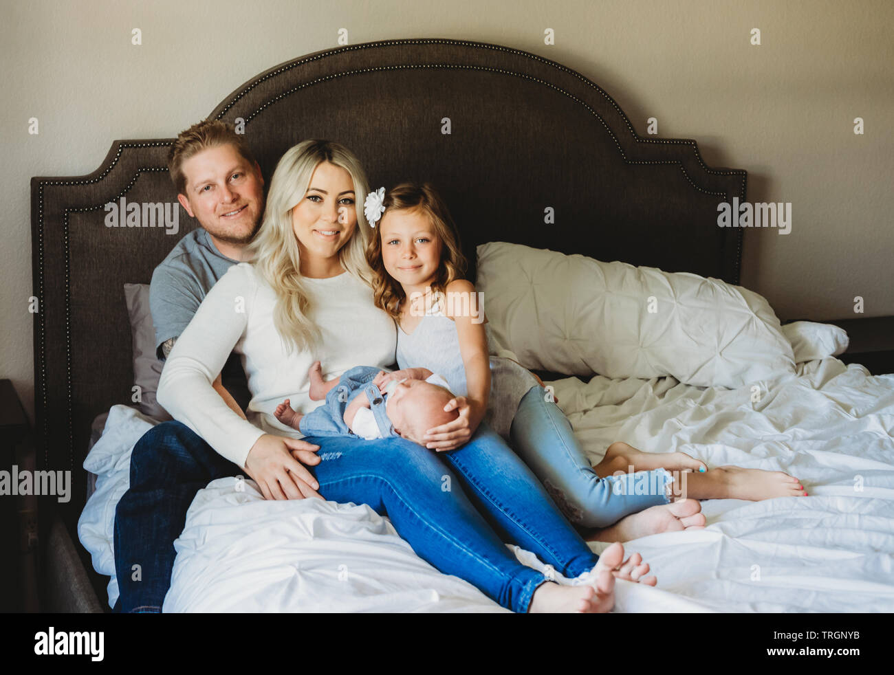 family at home with a new baby in the nursery Stock Photo - Alamy