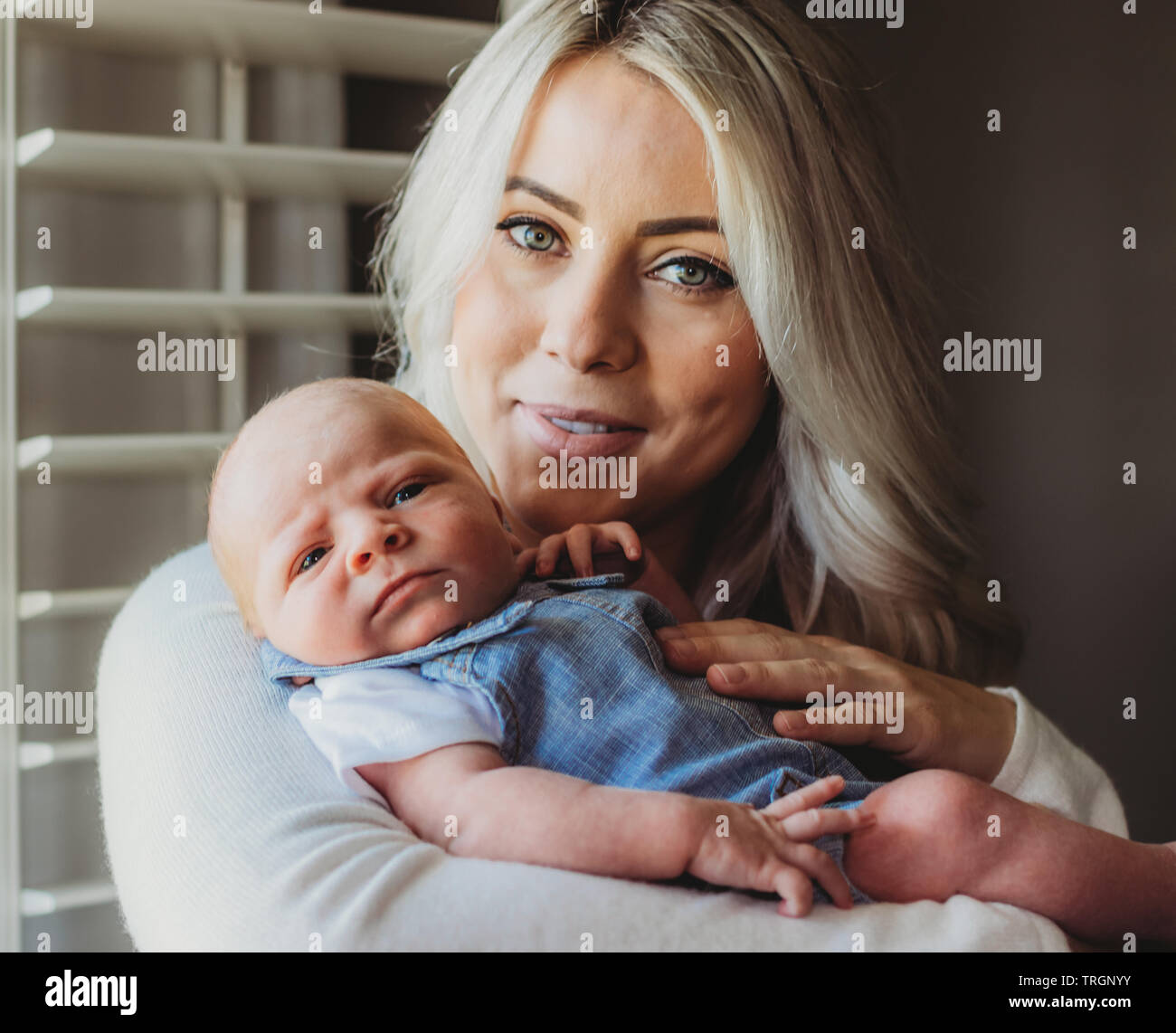 family at home with a new baby in the nursery Stock Photo - Alamy