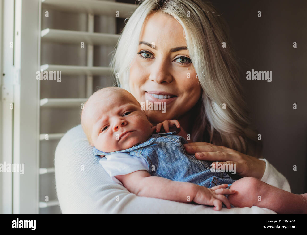 family at home with a new baby in the nursery Stock Photo - Alamy