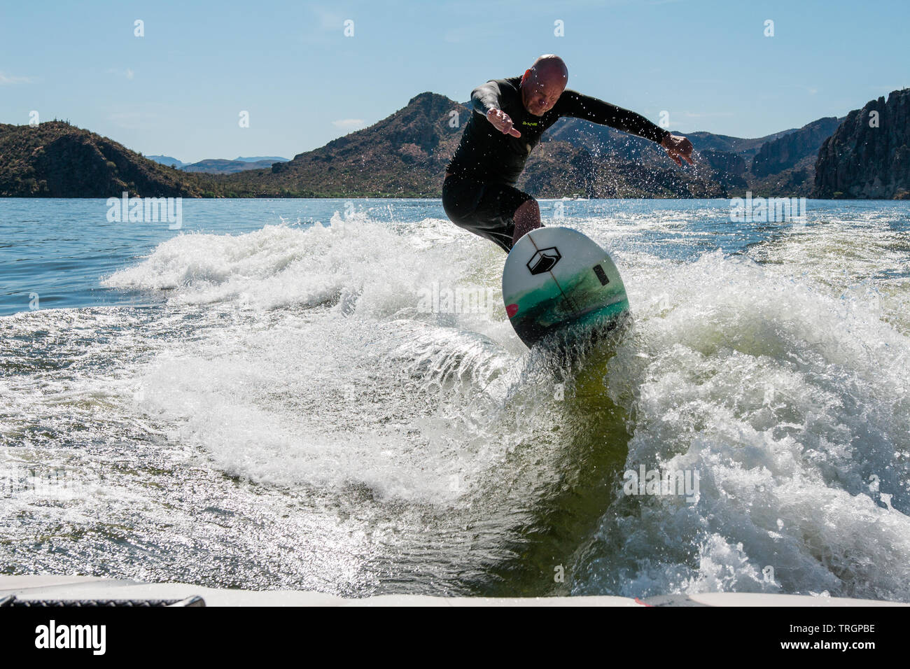 wake surfing wake surfers at the lake Stock Photo - Alamy