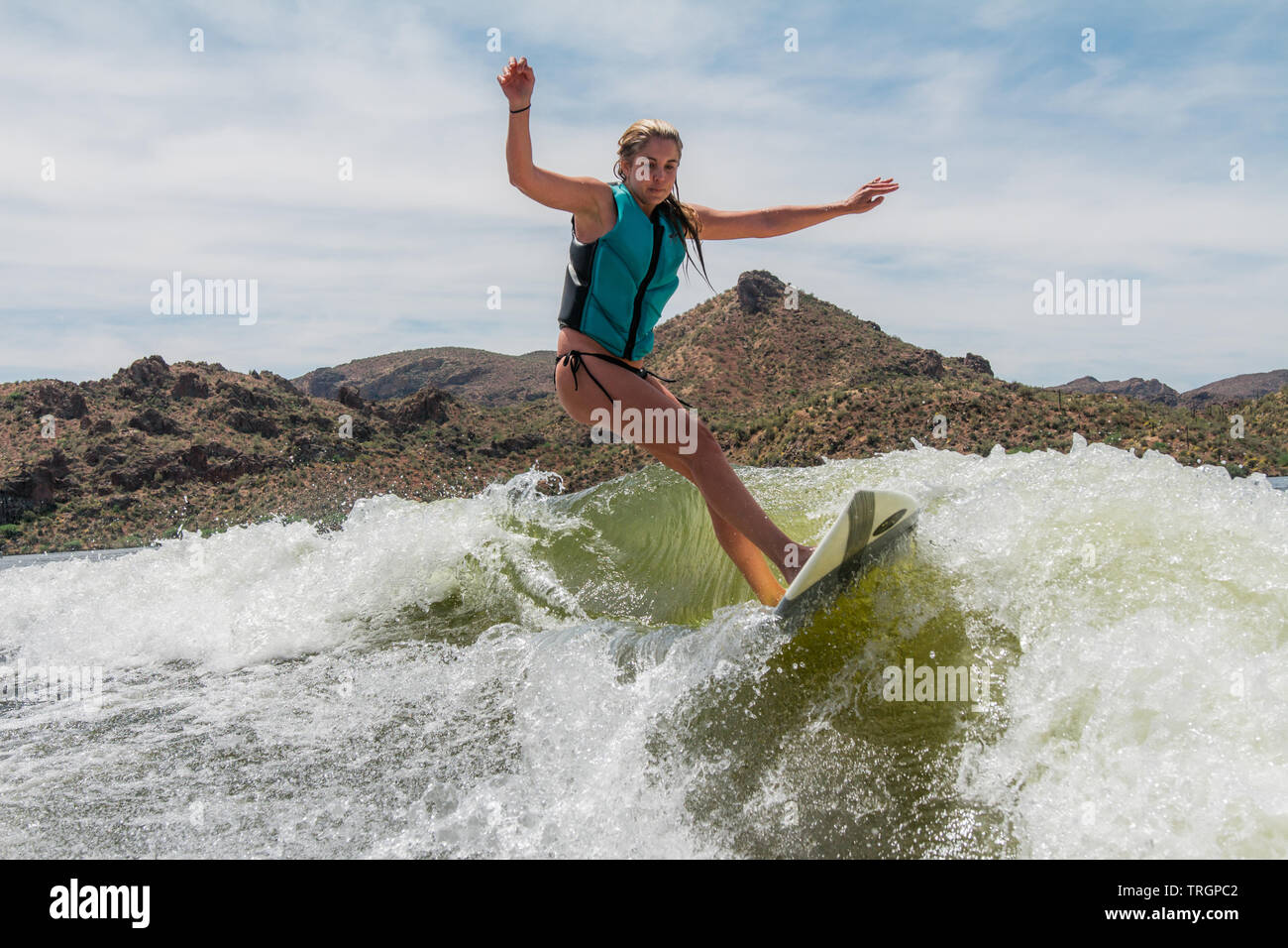 wake surfing wake surfers at the lake Stock Photo - Alamy