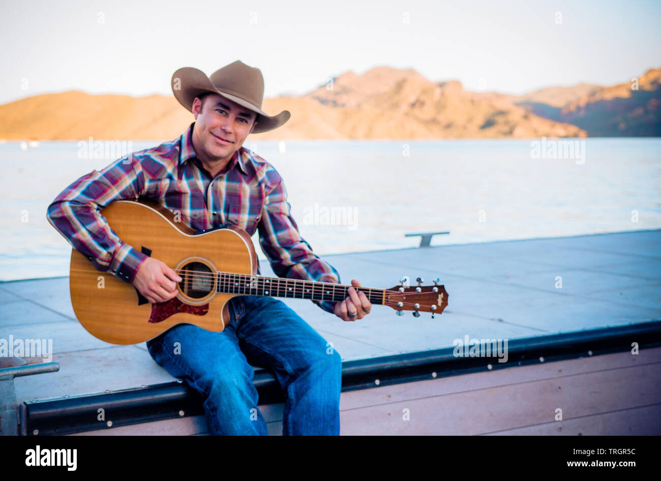 Country Couple On a Dock Romantic, Playing Music Stock Photo - Alamy