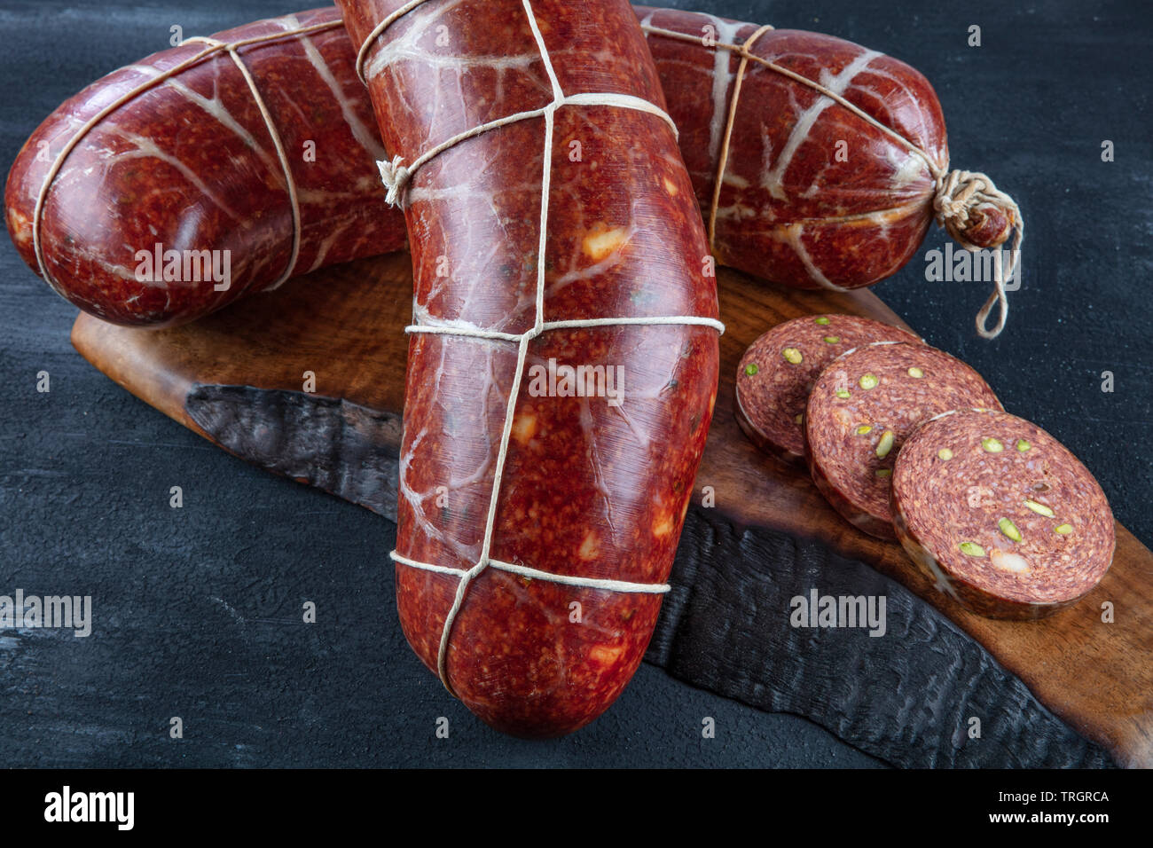 Traditional Hungarian speciality sliced sausage salami on wooden board ...
