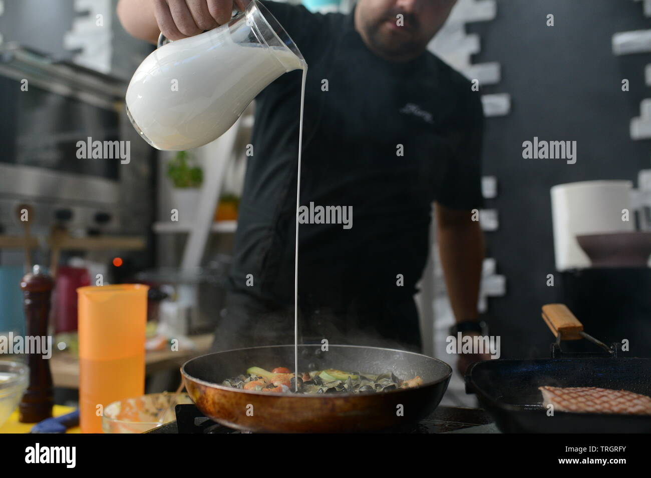 Chef prepares seafood dish in hi-res stock photography and images - Alamy