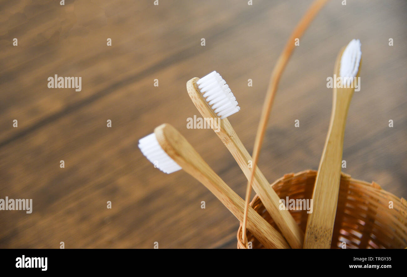 bamboo toothbrush in basket eco natural plastic free items on rustic ...