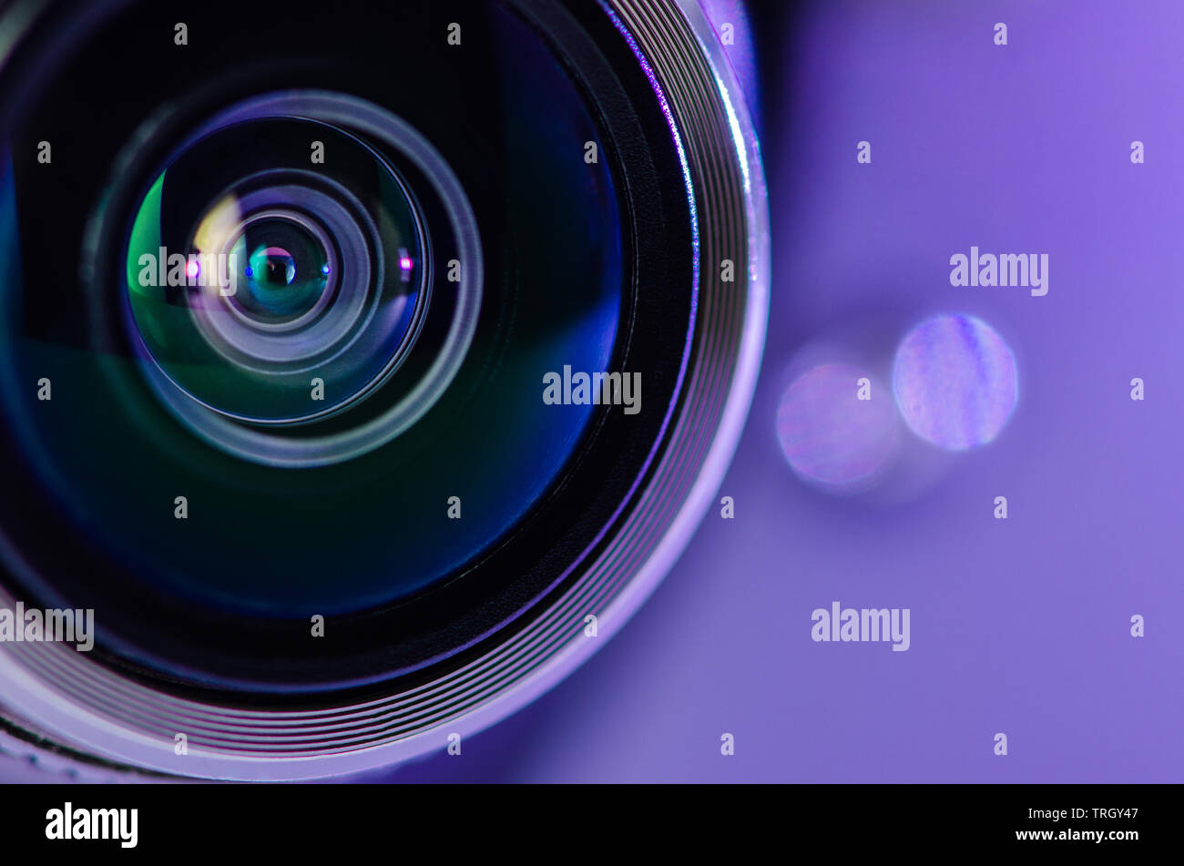 The camera lens and the beautiful light blue color . Horizontal photo ...