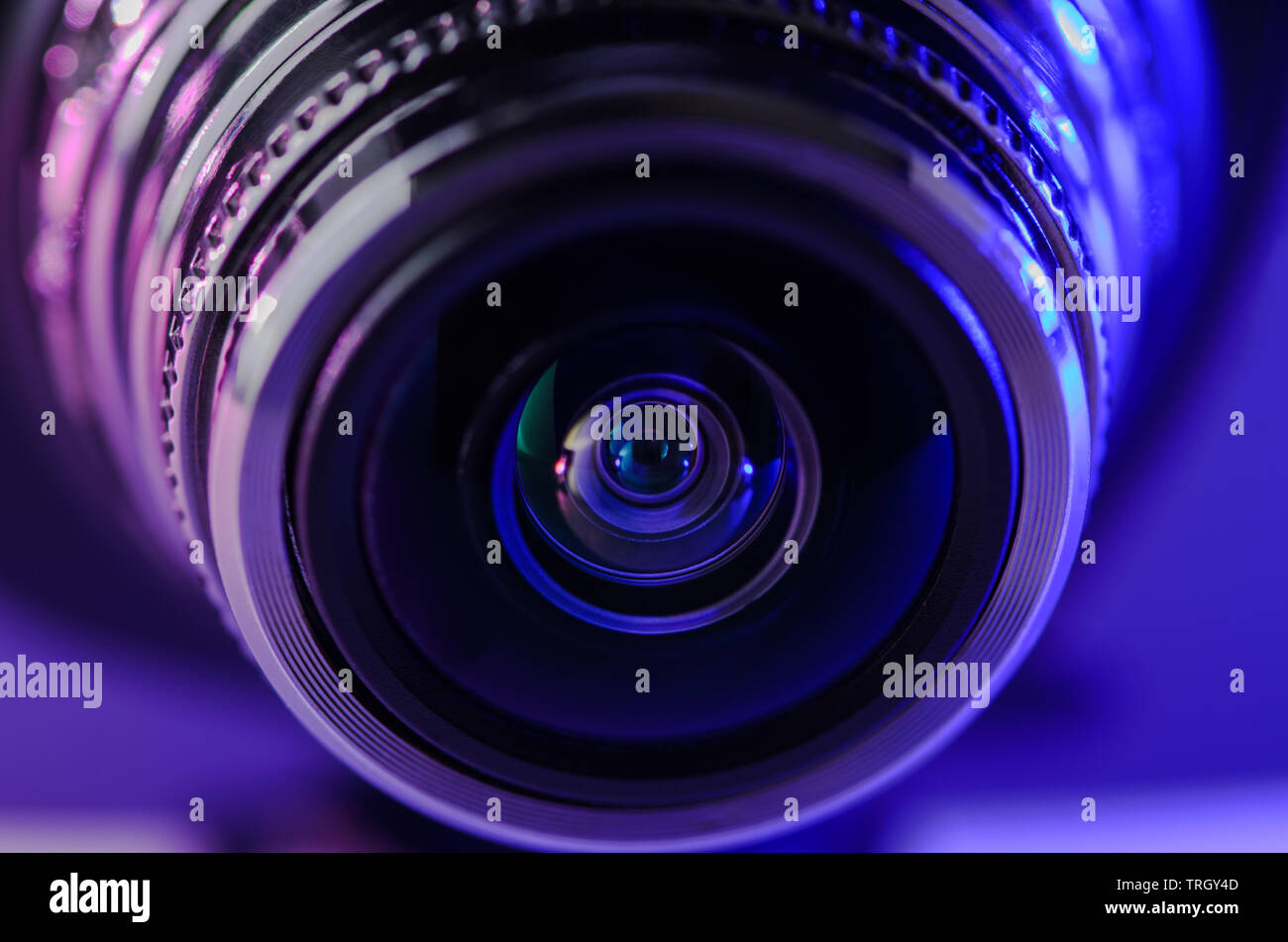 Camera lens and beautiful purple-blue backlight. Horizontal photo Stock ...