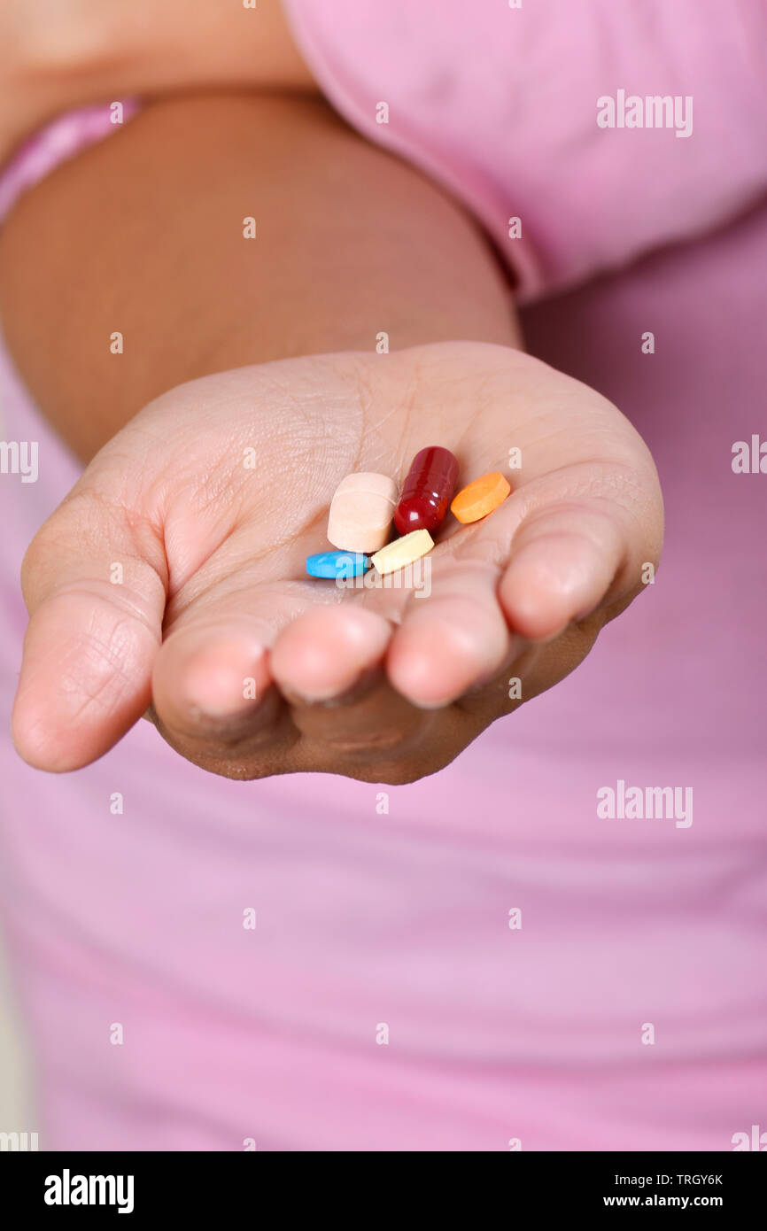 medicine in woman's hand, health concept Stock Photo - Alamy