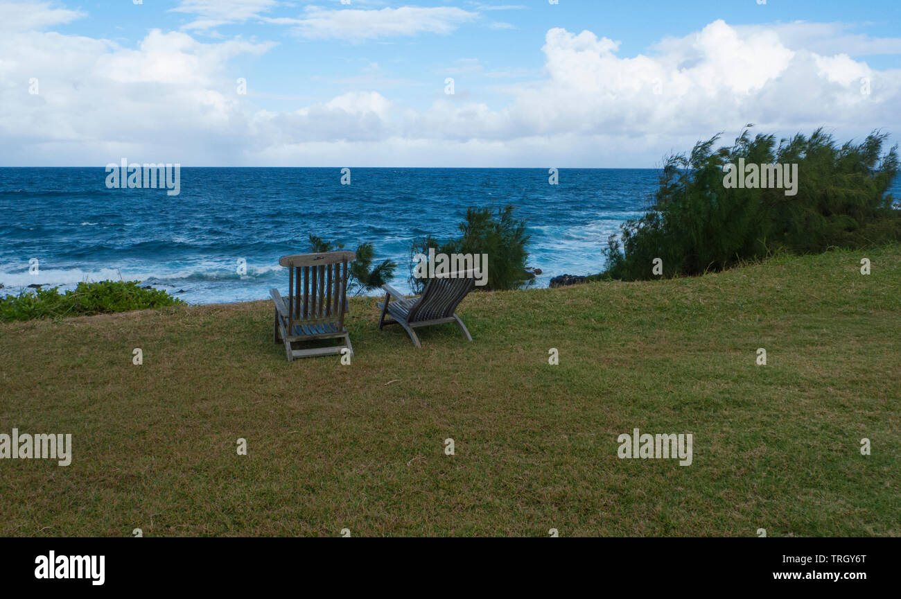 Two rustic chairs overlooking isolated ocean view Stock Photo - Alamy