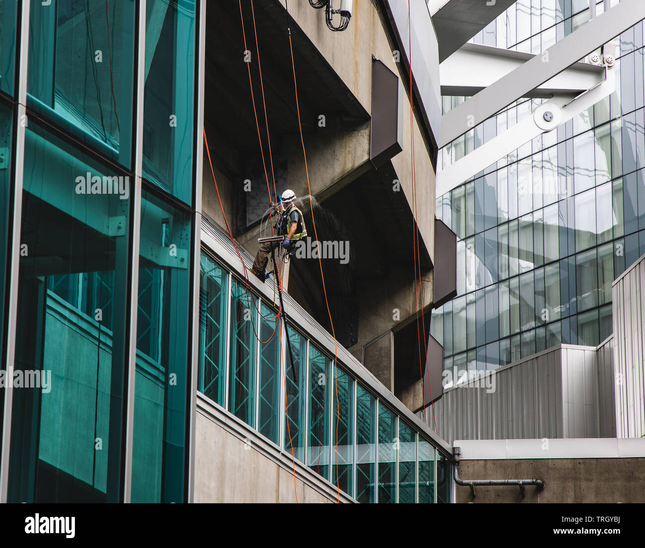 A window cleaner working Stock Photo - Alamy