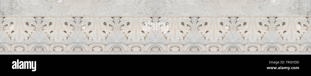 Old carved white stone frame with geometric and foliage shape ...