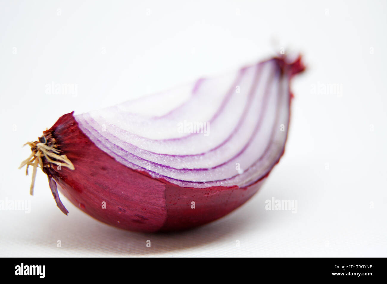 cut red onion on white background Stock Photo - Alamy