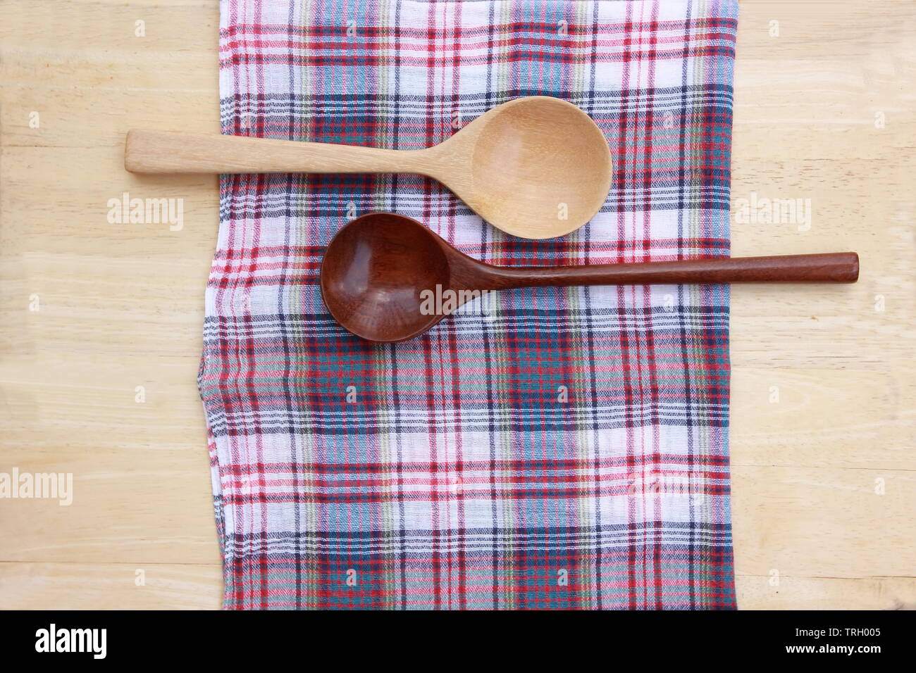 tpo view wooden frok and spoon on abstract fabric pattern on table with ...