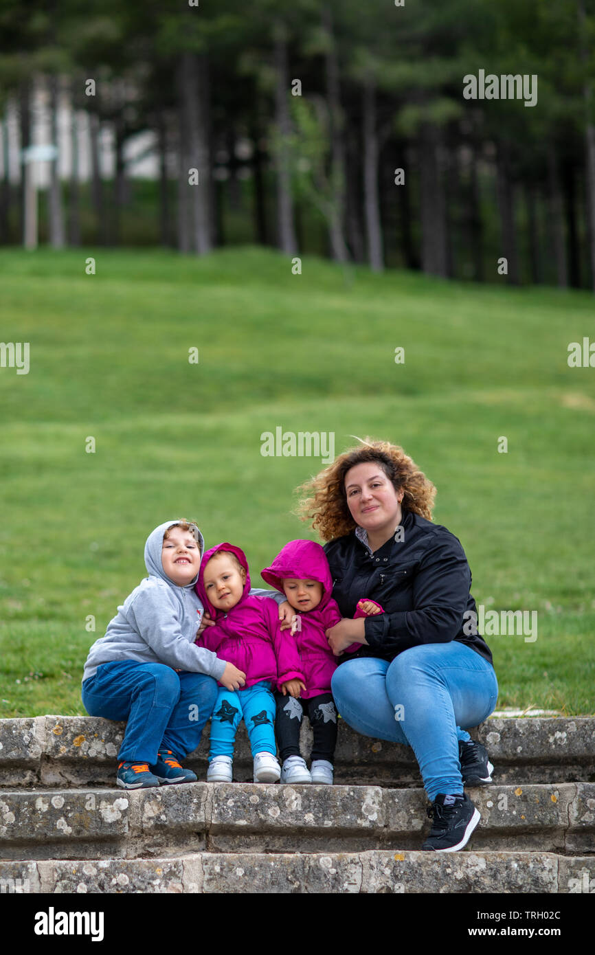 Separated woman with her three children, where are two twins and an ...