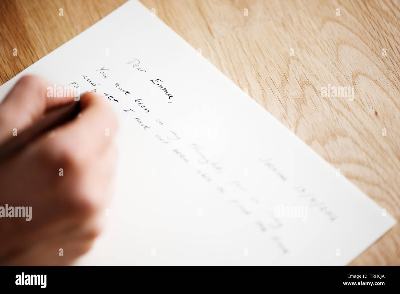 Writing letter to a friend. Selective focus and shallow depth of field ...