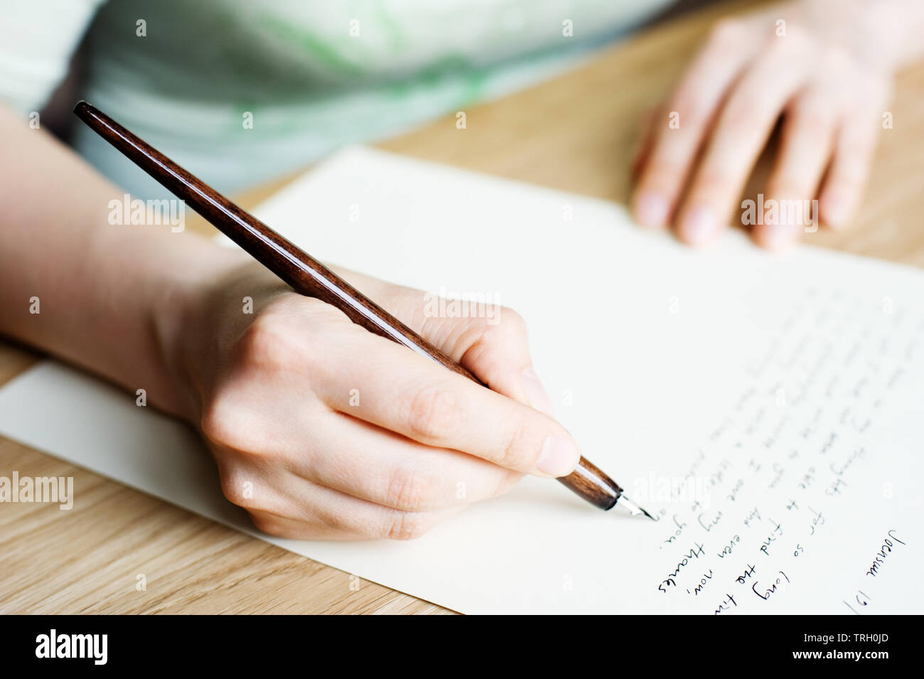 Writing letter to a friend. Selective focus and shallow depth of field ...