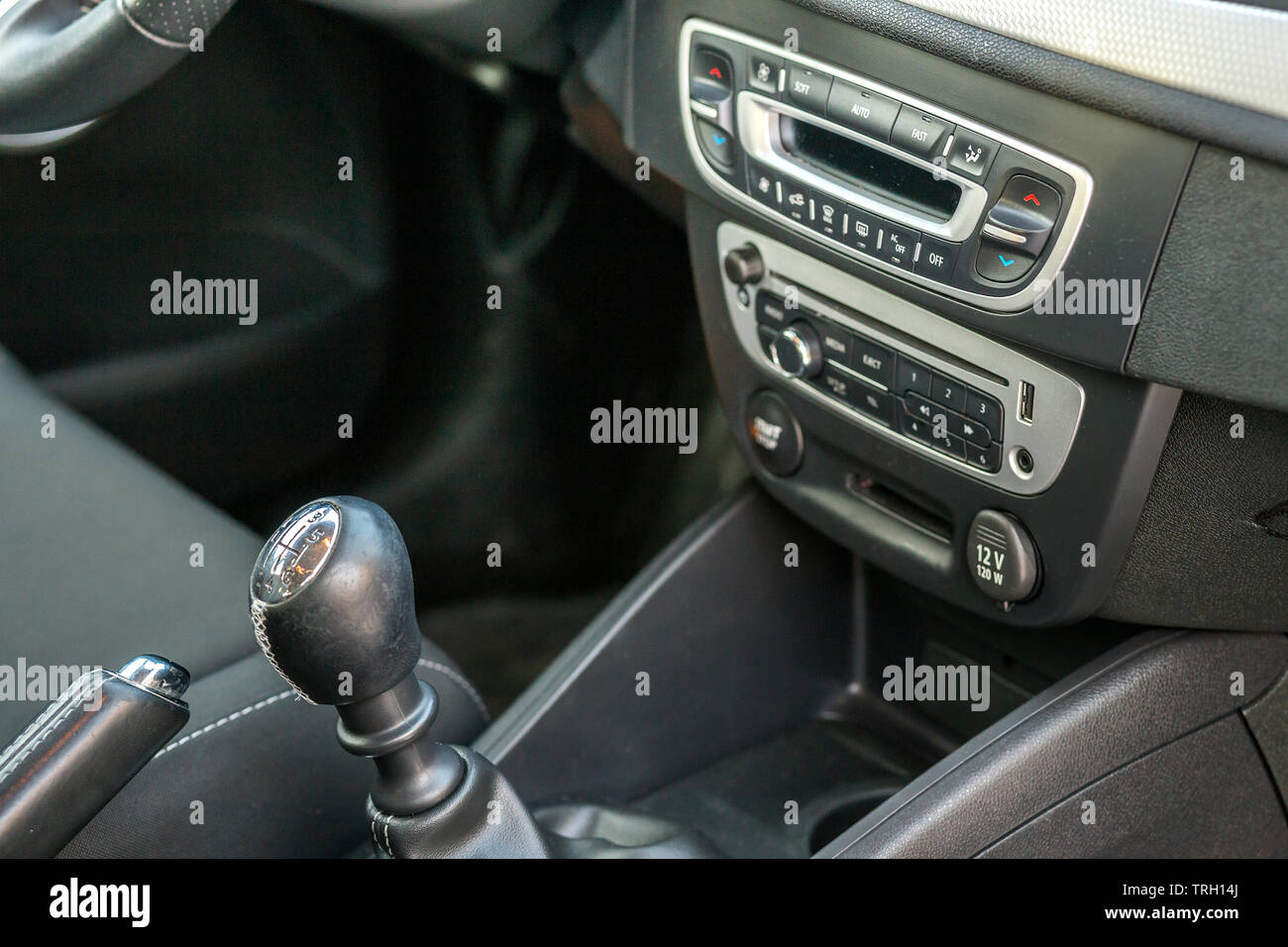 Luxurious car black leather interior. Close-up detail of handbrake ...