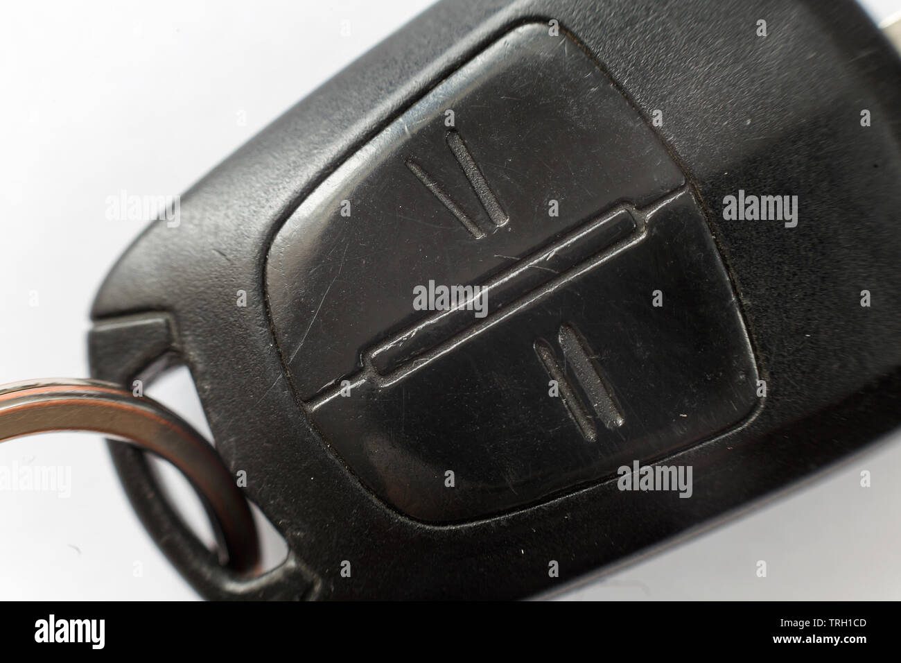 Close-up of car key with remote control buttons on white background ...