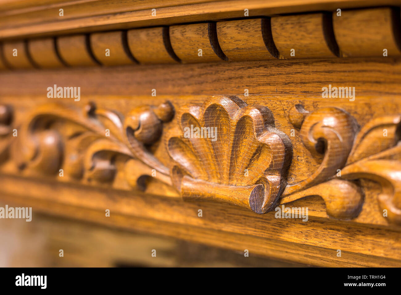 Close-up detail of carved wooden decorative piece of furniture with ...