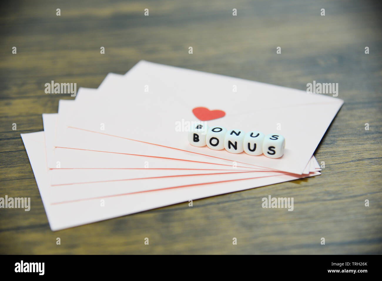 Yearly Bonus concept / card bonus with paper envelope and Red heart for ...