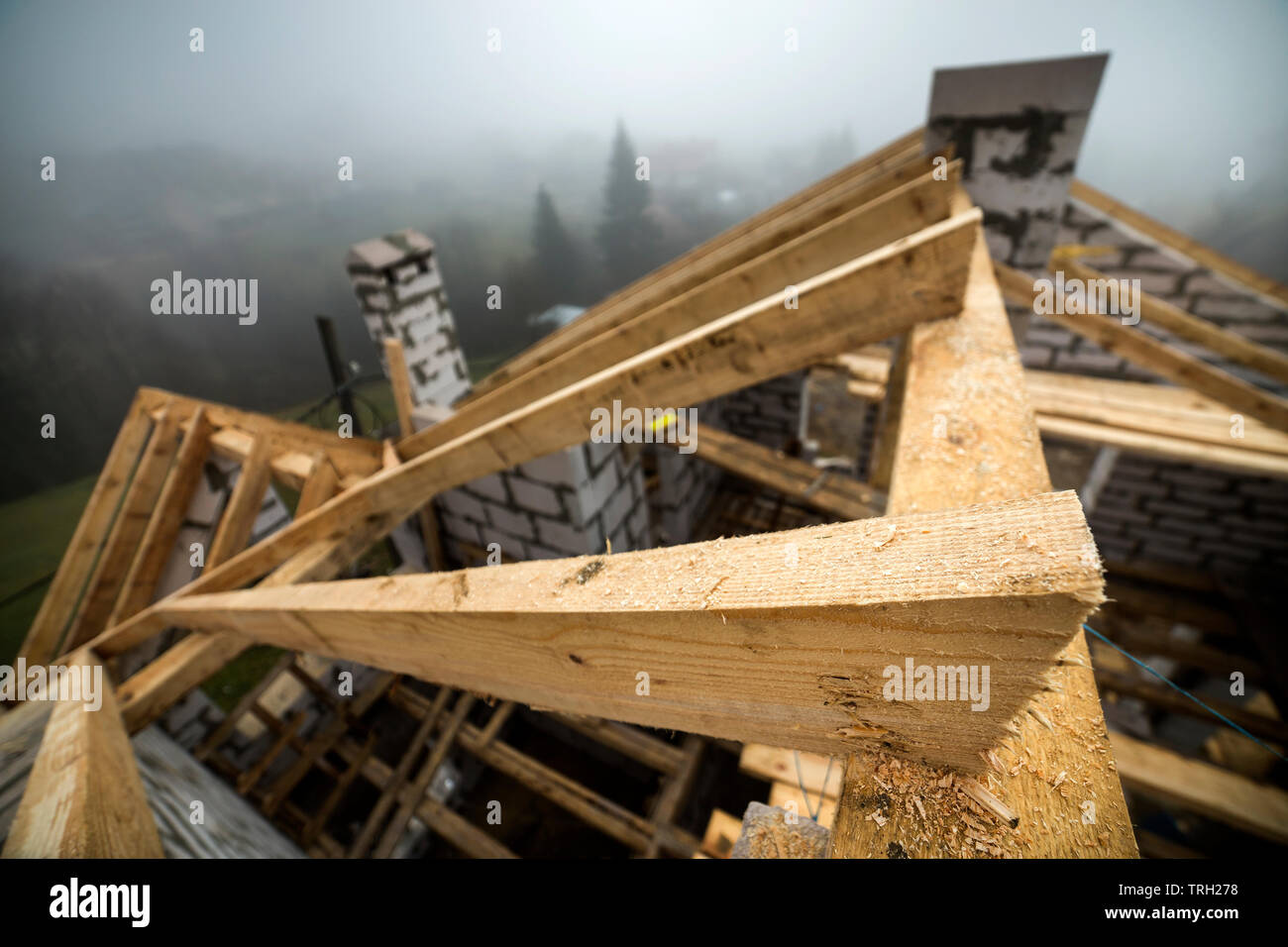 Top view of roof frame from wooden lumber beams and planks on walls ...