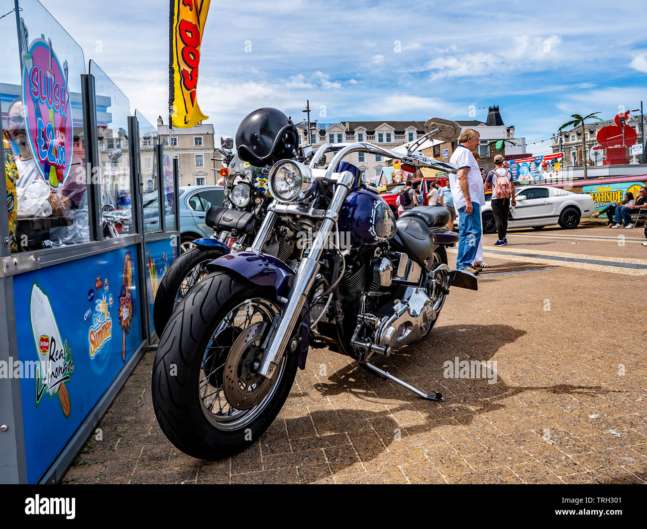Classic Harley Davidson motorcycles parked up outside an American style ...