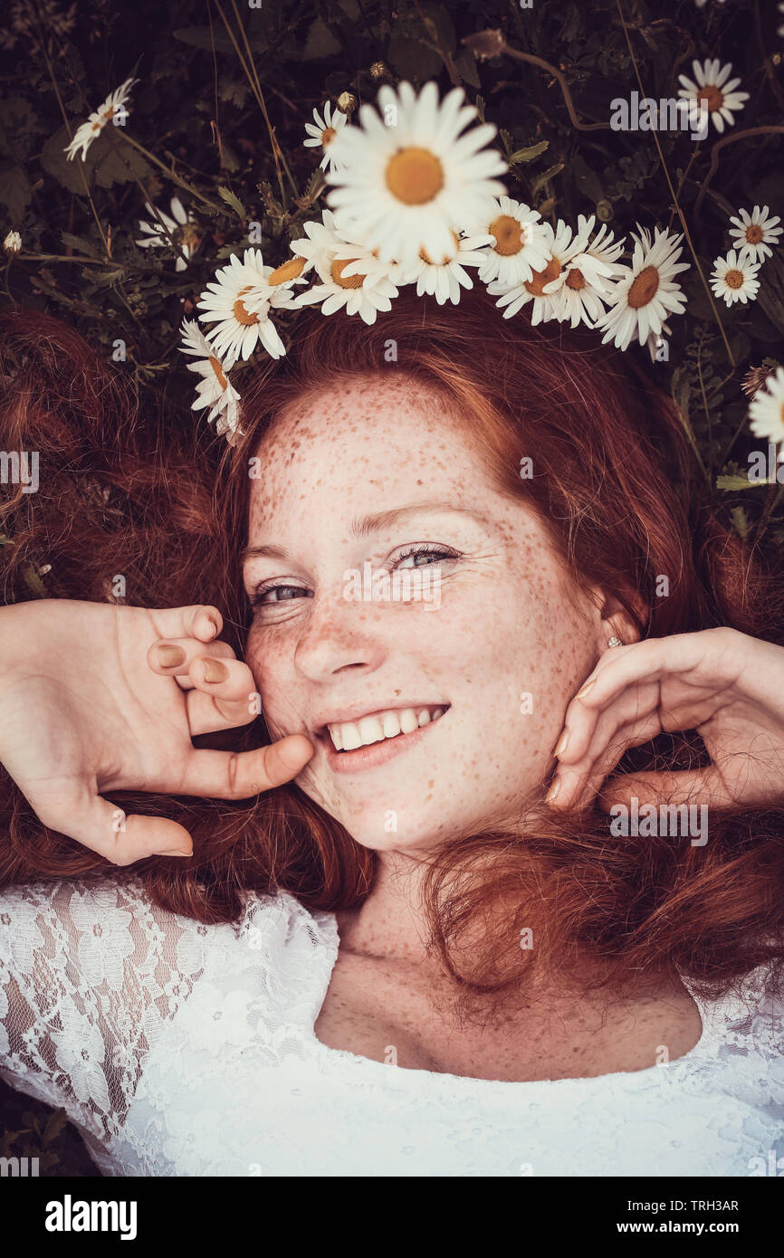 Image Of Pretty Woman Lying Down On Chamomile Field Happy Female