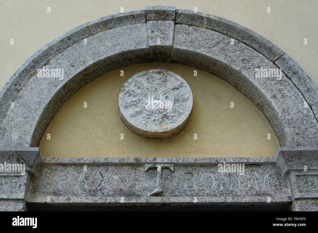 JHS Christogram of the stone above the lateral entrance of church of ...