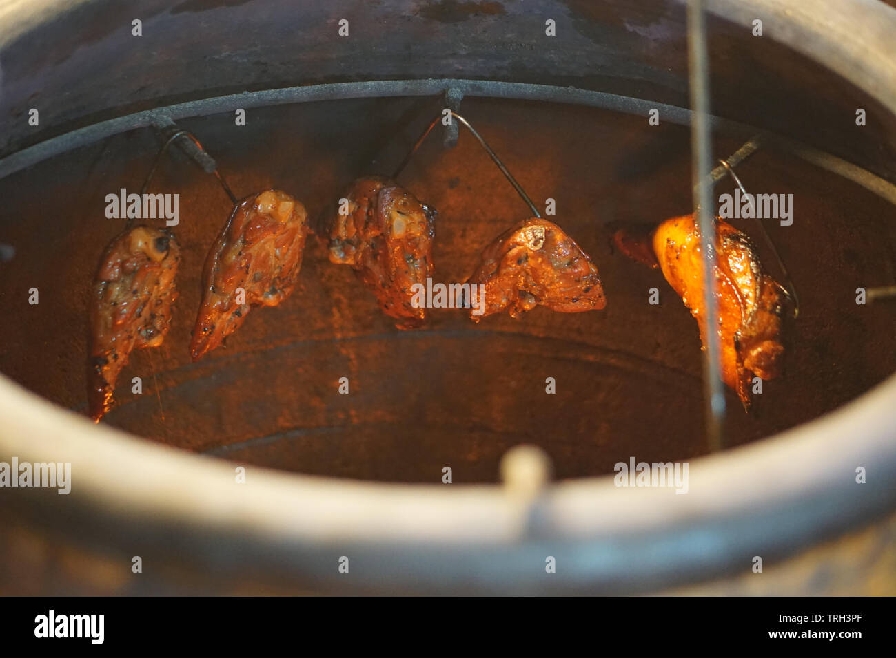 hot smoking chicken meat in a big pot Stock Photo - Alamy