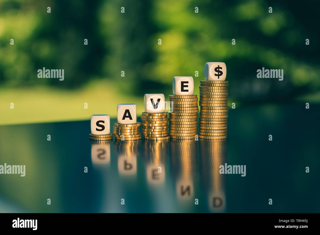 Symbol for saving or spending money. Dice form the word "save" while ...