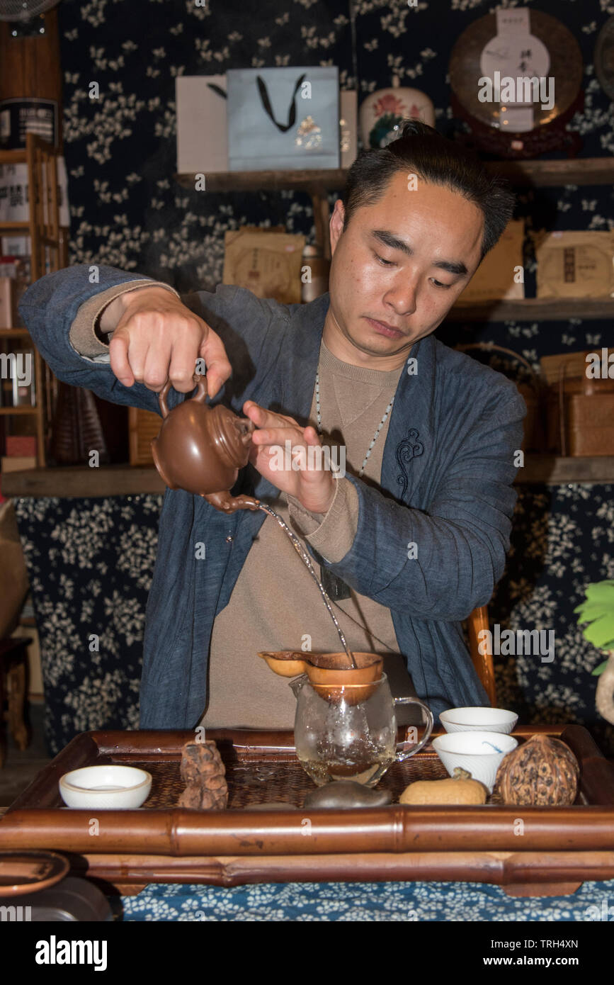 Chinese Tea Ceremony. Male server prepares the traditional tea ...