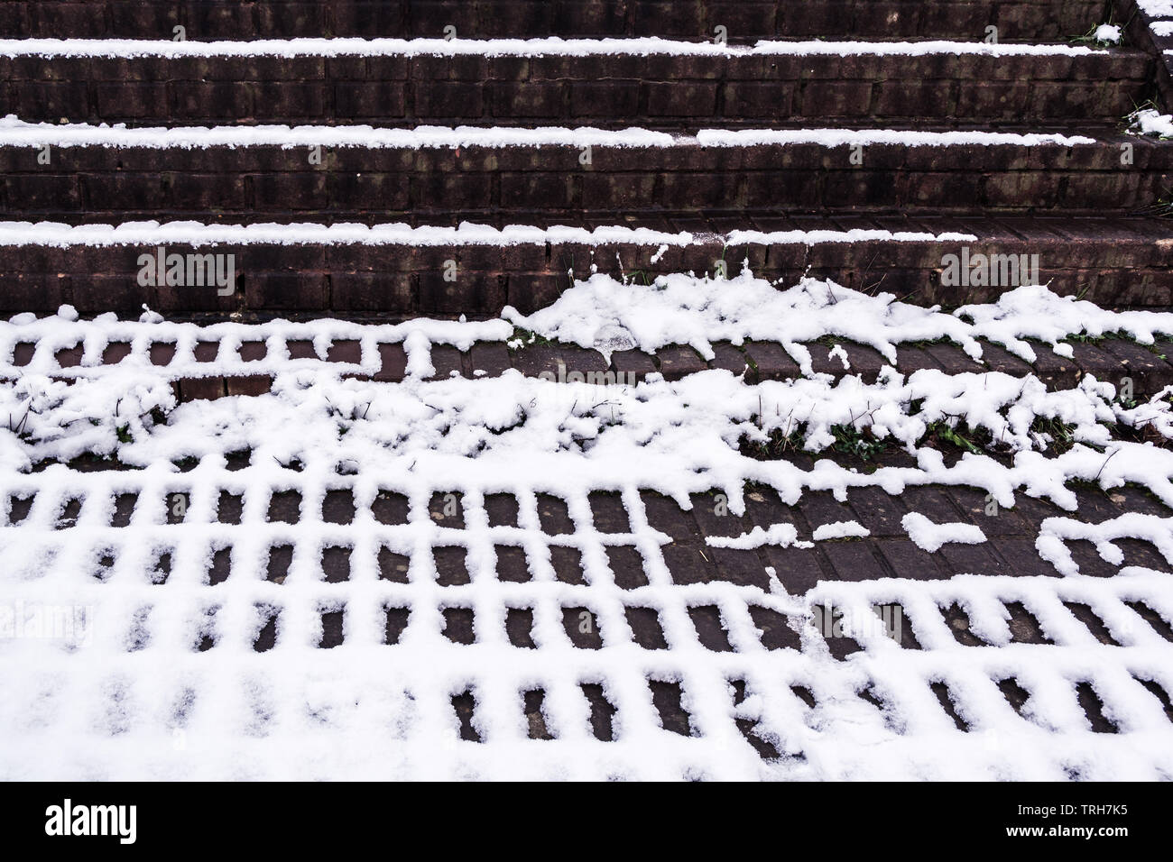 Brick steps and snow pattern - winter abstract Stock Photo - Alamy